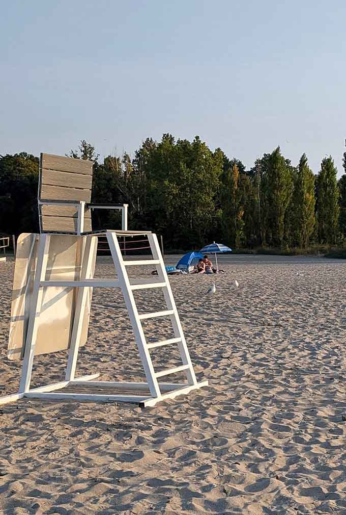 The lifeguard stand waiting for summer crowds, a reassuring presence that lets parents breathe easier during swimming season.