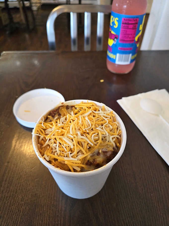 A cup of chili crowned with shredded cheese is the warm hug your stomach didn't know it needed.