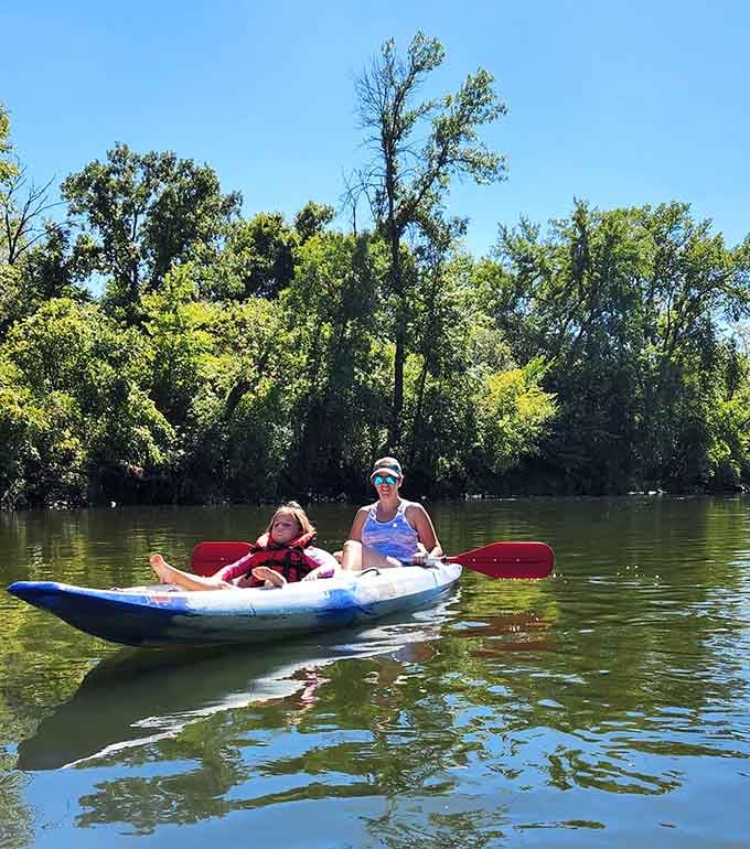 Kayaking the calm waters with the next generation, making memories one paddle stroke at a time.