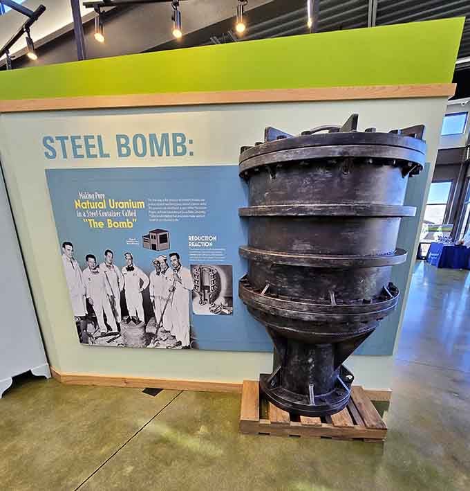 An actual steel reduction vessel used in uranium processing stands as a tangible reminder of the site's nuclear past.