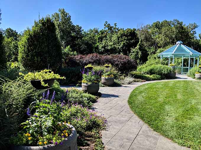Winding paths lead you through perfectly manicured spaces that somehow feel wild and welcoming simultaneously.