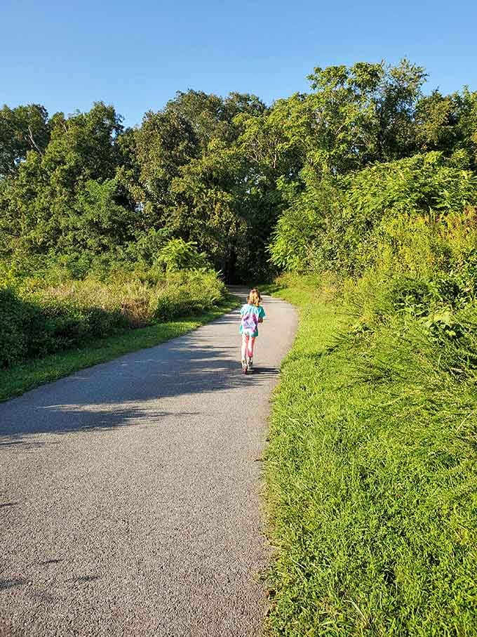 Paved paths winding through green spaces, perfect for scooters, bikes, and ambitious toddlers on training wheels.