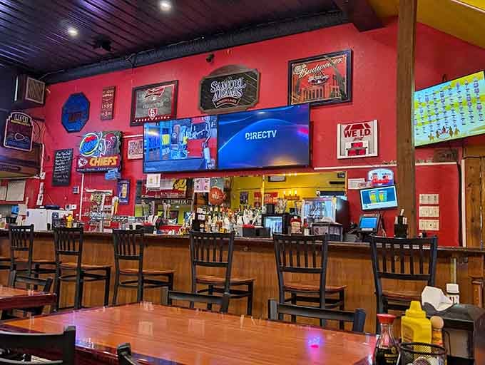 The bar area glows with neon signs and local pride, where cold drinks meet warm Midwestern hospitality daily.