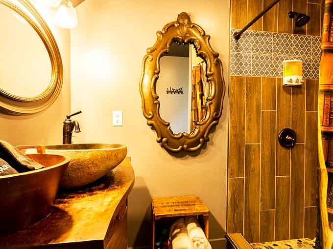 An ornate mirror and vessel sink prove that even wizards appreciate good bathroom design and proper lighting.