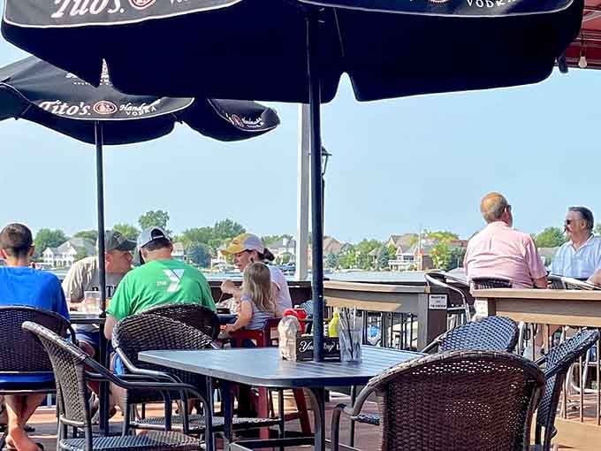 Casual outdoor dining under branded umbrellas: where strangers become friends over shared good taste.