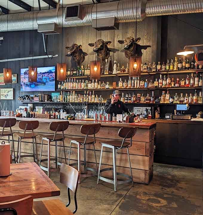Those longhorn skulls watching over the bourbon selection add authentic Texas flair to this impressive bar setup.