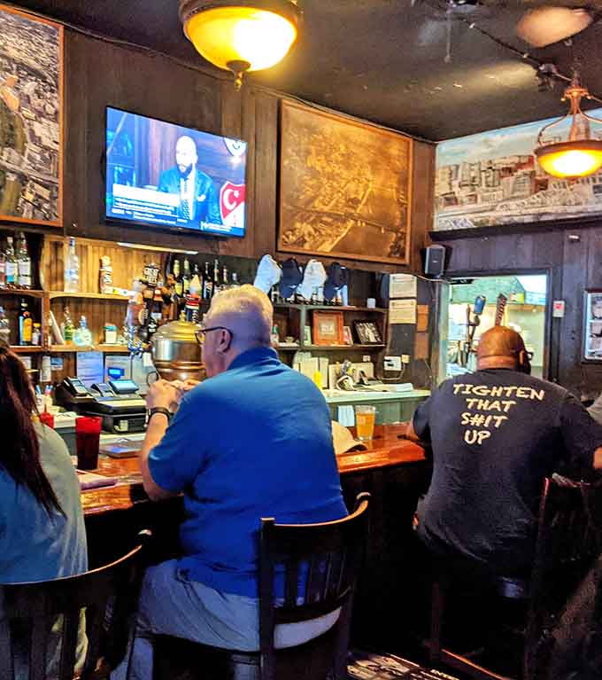 The bar area where locals gather, stories flow, and everyone knows this is their happy place forever.