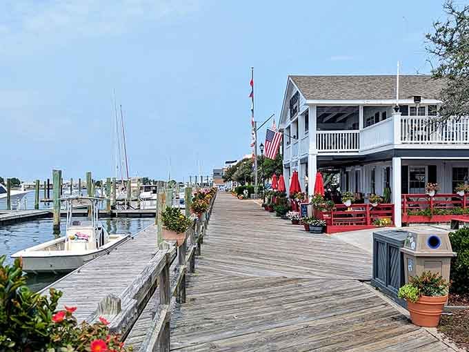 Wooden boardwalks stretch along the marina where boats bob gently like they're nodding off to sleep.