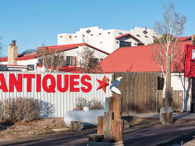 That bird sculpture and antiques sign capture the quirky spirit of a town that never takes itself too seriously.