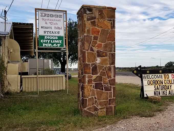 That stone pillar and vintage sign mark the entrance to serious steak territory in small-town San Saba.