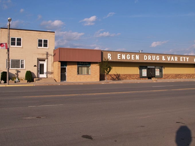 The old-school drug store sign stretches long and proud, a reminder when pharmacists knew your family's medical history by heart.