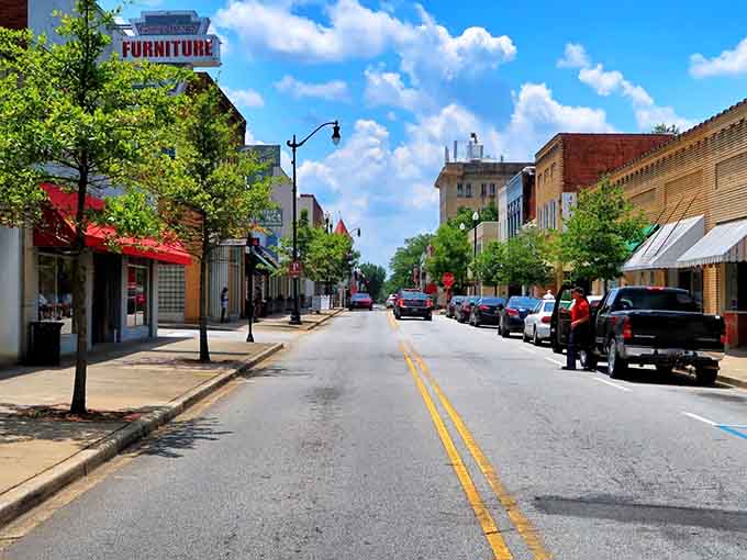 Main Street stretches wide and welcoming under blue skies, with storefronts that invite you to slow down and browse.