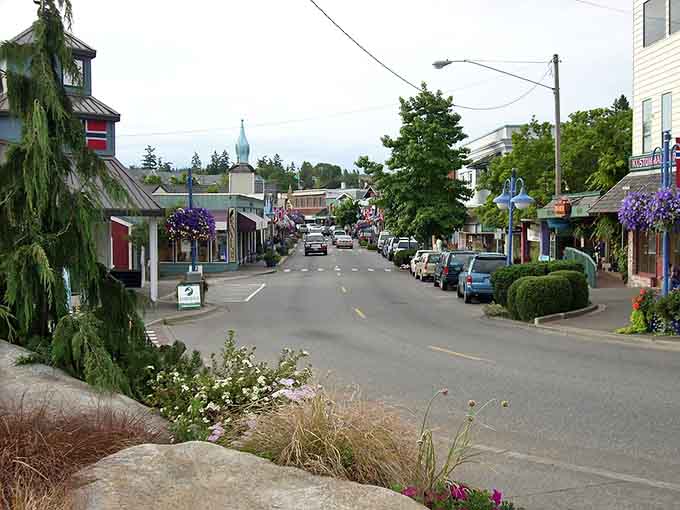 Those purple hanging baskets lining the street add a splash of color that makes every stroll feel special.