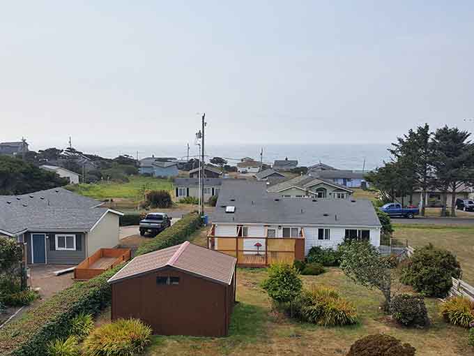 Ocean mist hangs over coastal homes where the Pacific provides the world's most dramatic backyard view.
