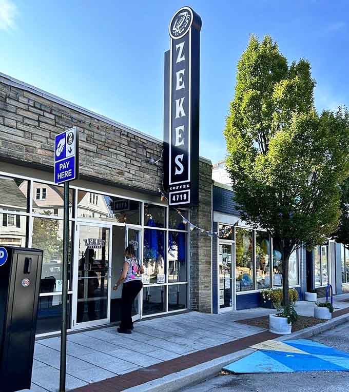 The towering vertical sign reaches skyward like a lighthouse guiding coffee lovers safely to shore.