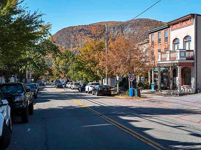 Mountains frame the street in the distance, reminding you that small-town charm and natural beauty make perfect neighbors.