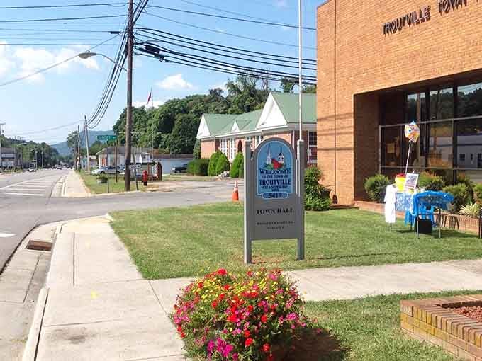 Manicured lawns and mountain views frame this peaceful town center where community pride blooms in every flower bed.
