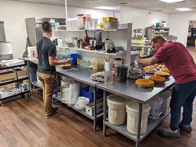 Behind the scenes, skilled hands craft the magic that keeps people driving across state lines for just one more slice.