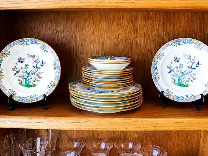 Vintage plates displayed like museum pieces, ready to elevate your next dinner party from paper to proper sophistication.