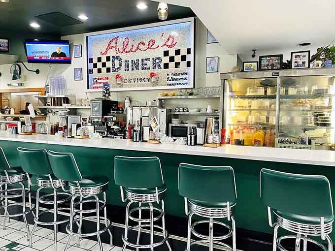 That classic diner counter with chrome stools invites you to sit, spin slightly, and watch breakfast magic happen.