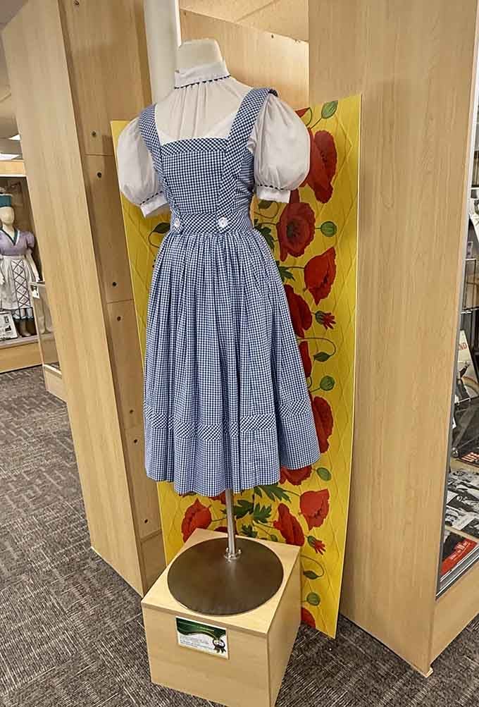 Dorothy's iconic gingham dress hangs perfectly preserved, the uniform of dreamers everywhere for over eight decades running.