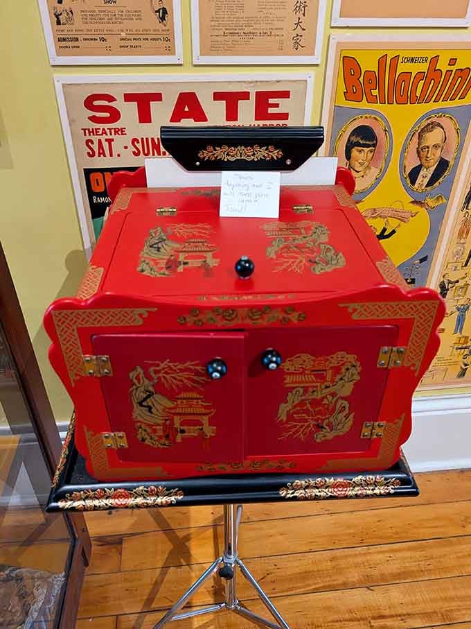 This ornate red cabinet probably made countless objects vanish, reappear, or transform into something completely unexpected and delightful.