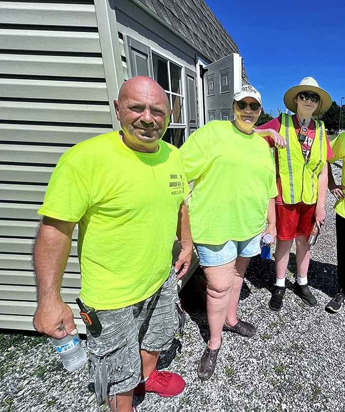 Friendly staff in bright safety gear ready to send you off with smiles, encouragement, and probably some dad jokes.