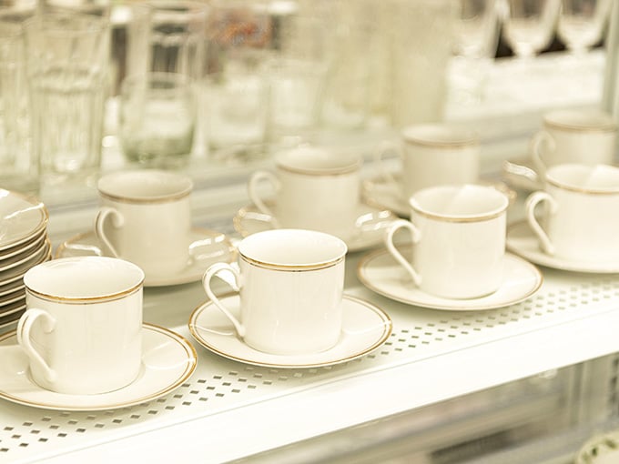 Fine china and everyday mugs coexist peacefully, ready to elevate your morning coffee or fancy dinner party.