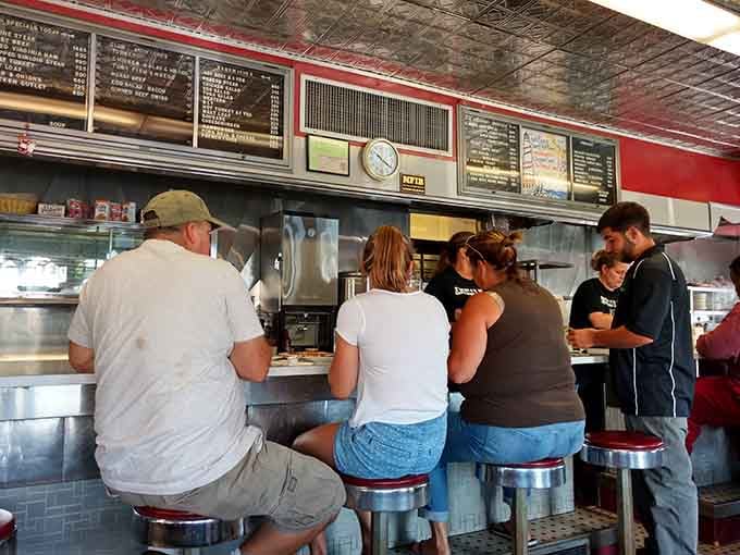 Counter seating where strangers become neighbors and everyone's united by the universal language of breakfast.