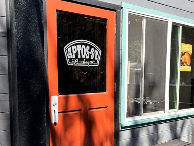The bright orange door welcomes you like a beacon of barbecue hope on the California coast.