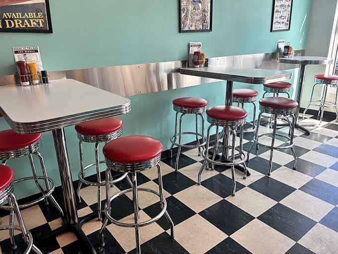 Vintage Coca-Cola signage and chrome accents create the kind of atmosphere that makes every meal feel special.