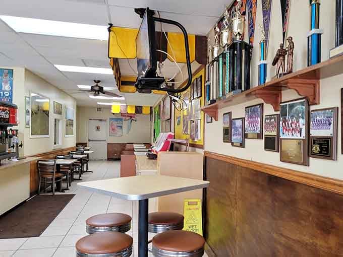 Sports memorabilia and a ceiling fan create an atmosphere that's part diner, part community gathering spot, all welcoming.