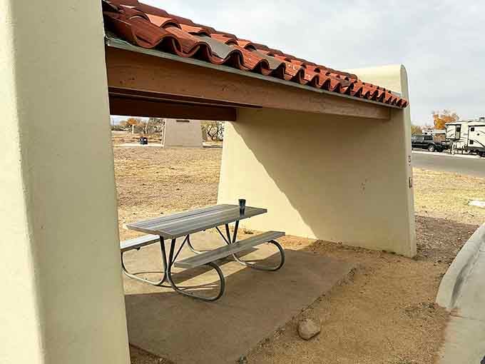Covered picnic shelters with terra cotta roofs provide respite from the sun between your marathon swimming sessions.
