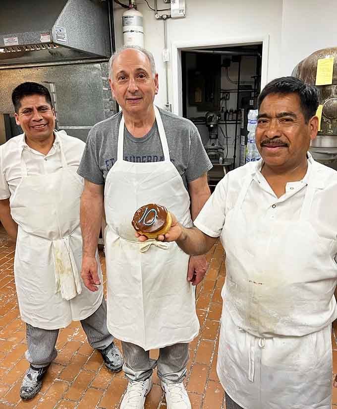 The smiling faces behind the counter prove that making people happy with pastries is the best job.
