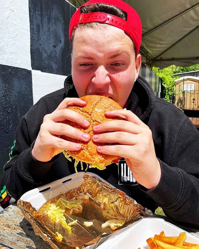 Wide-eyed determination meets one-pound reality as this brave soul attempts to conquer the legendary Super Burger challenge.