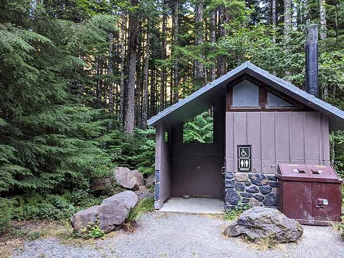 Even the restroom facilities blend seamlessly into the forest setting, maintaining that wilderness experience throughout.