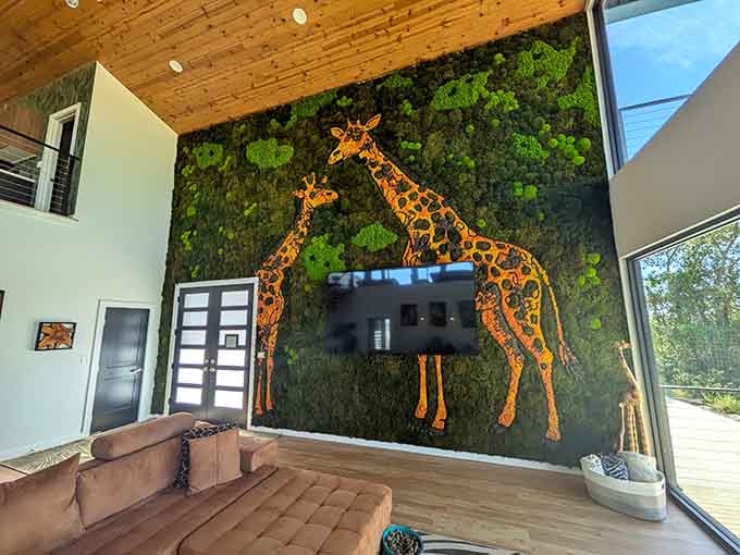 Living moss wall art featuring giraffe silhouettes brings the outside in, for moments when you need nature without actual giraffe breath.