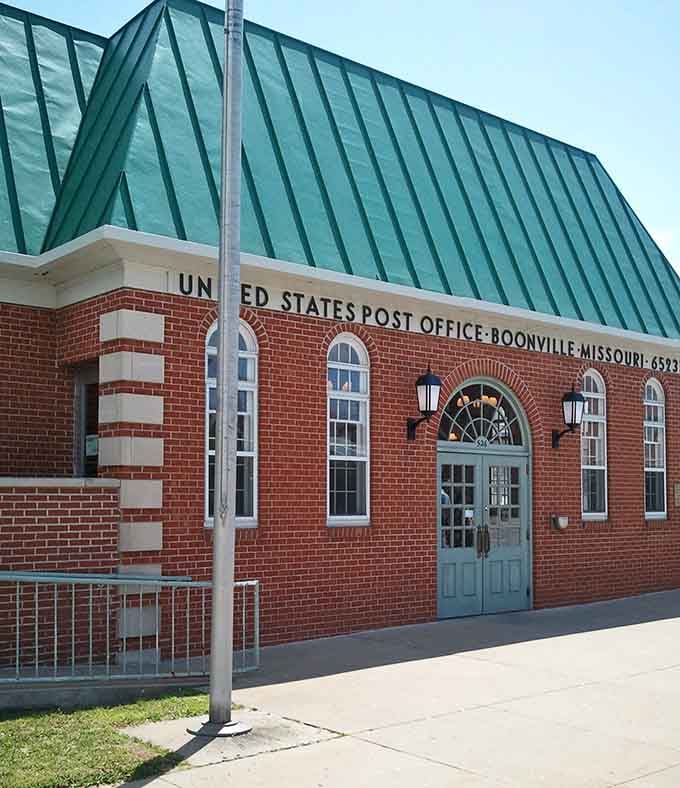 The post office's distinctive green roof and classic brick construction remind us when government buildings had real personality.