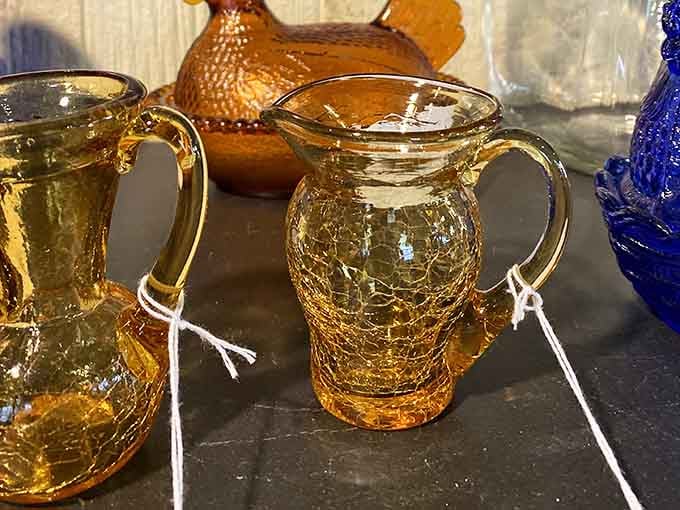 These amber crackle glass pitchers catch the light like liquid sunshine. Depression-era glassware never looked so cheerful.