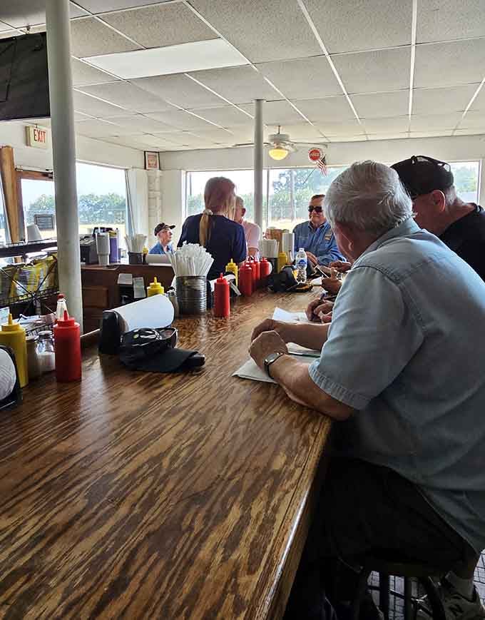Behind this counter, efficiency meets flavor as staff turn simple ingredients into lunchtime legends worth repeating.