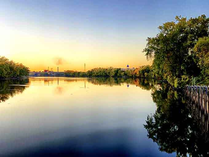Golden hour turns the river into liquid gold, and the bridge becomes the jewelry holding it all together.