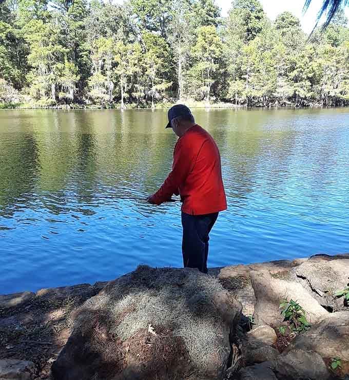 Casting a line into these dark waters connects you to generations of anglers who've tested their luck here.