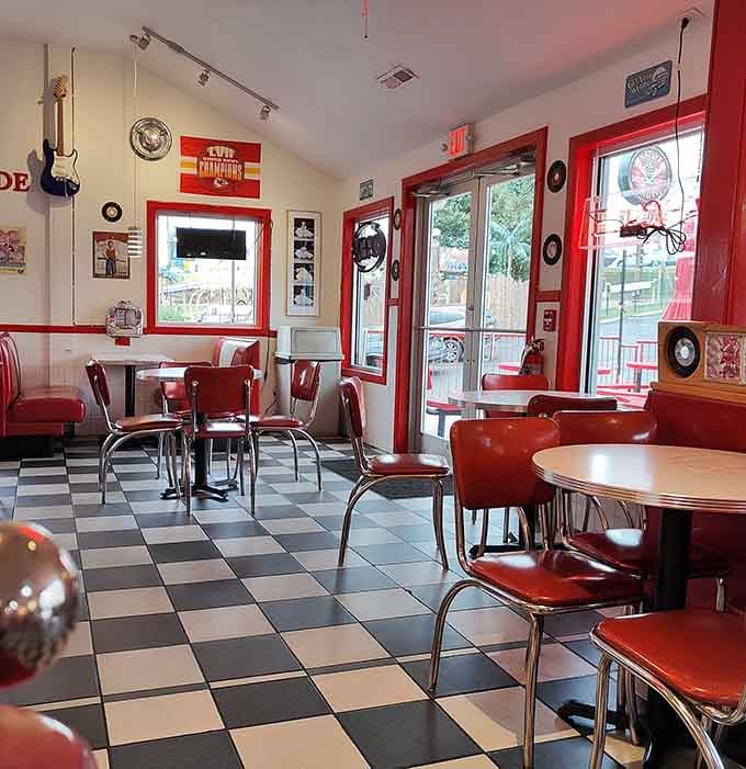 Red vinyl booths and vintage guitars on the walls create an atmosphere where every meal feels like a special occasion.