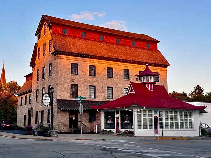 The historic limestone building glows golden at sunset, proving that good bones never go out of style, architecturally speaking.