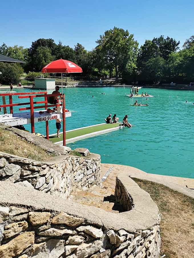 The head guard station perched on limestone quarry walls offers lifeguards a commanding view of every swimmer enjoying this converted industrial marvel.