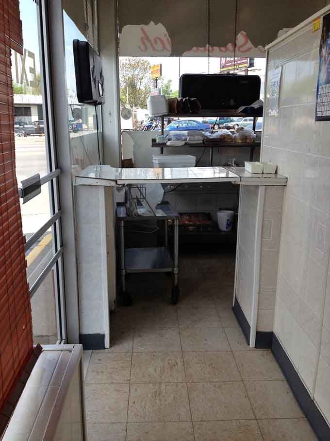 The pickup window where dreams become reality and hunger meets its delicious, crispy match.