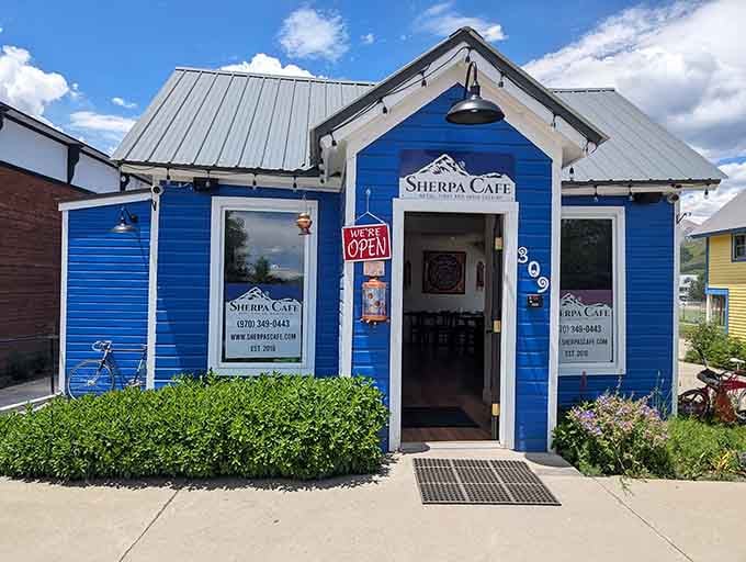 Sherpa Cafe's bright blue exterior promises the kind of fuel hikers need before tackling those mountain trails.