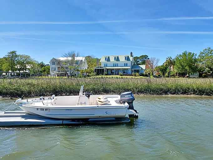 Historic waterfront homes peek through the marshland, their porches witnessing centuries of Charleston stories from their privileged perch.