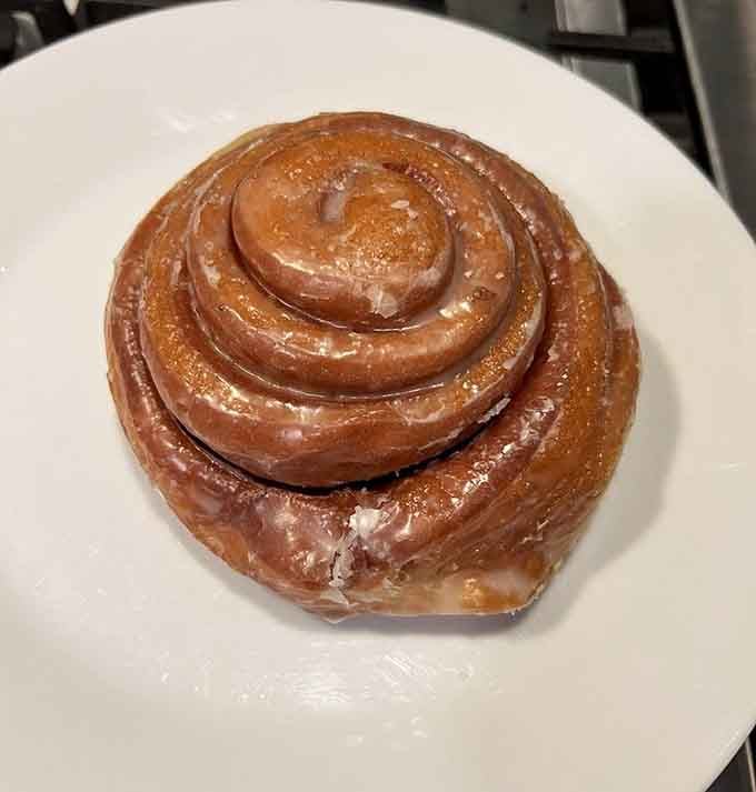 That cinnamon roll spiral could hypnotize you into ordering three, and honestly, who could blame you?