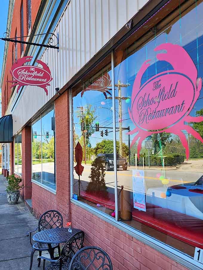 The Schoolfield Restaurant's pink signage and vintage storefront charm invite you inside for a meal that feels like coming home.